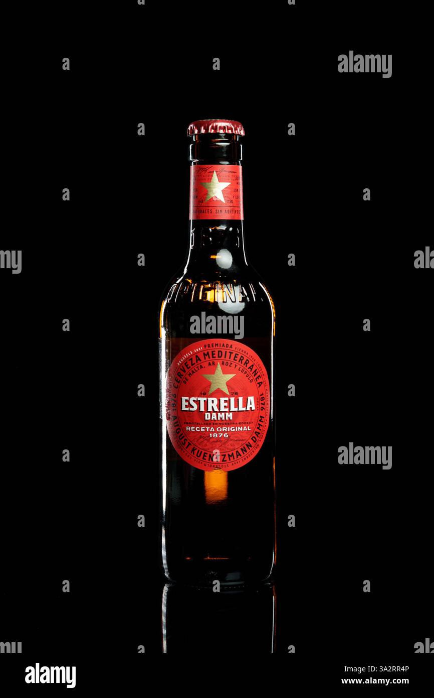 Estrella Damm beer bottle with reflection on black background Stock ...