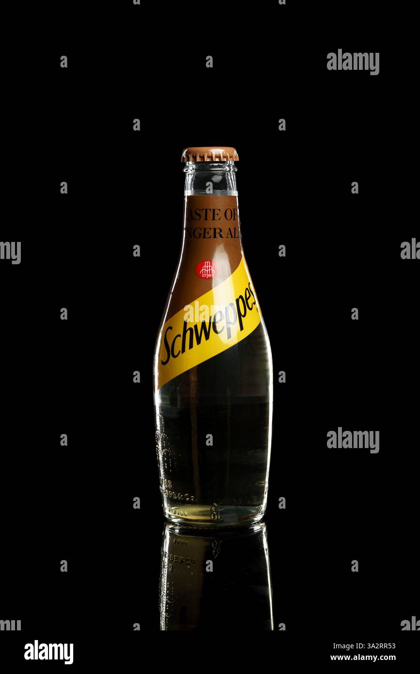 Schweppes Ginger Ale soda bottle with reflection on black background ...