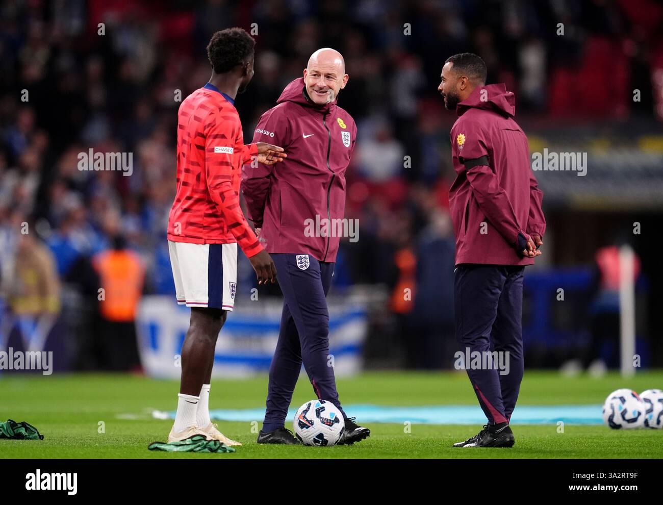 England interim manager Lee Carsley (centre) and assistant Ashley Cole ...