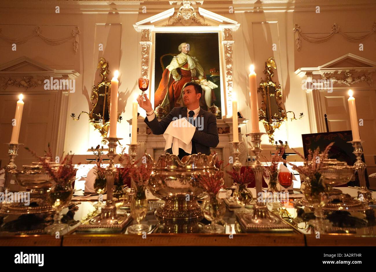 Evan Samson who leads the front of house team at Dumfries House checks the glasses as he puts ...