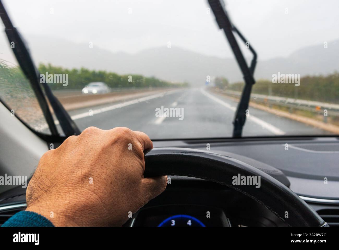 Mans hand gripping steering hi-res stock photography and images - Alamy
