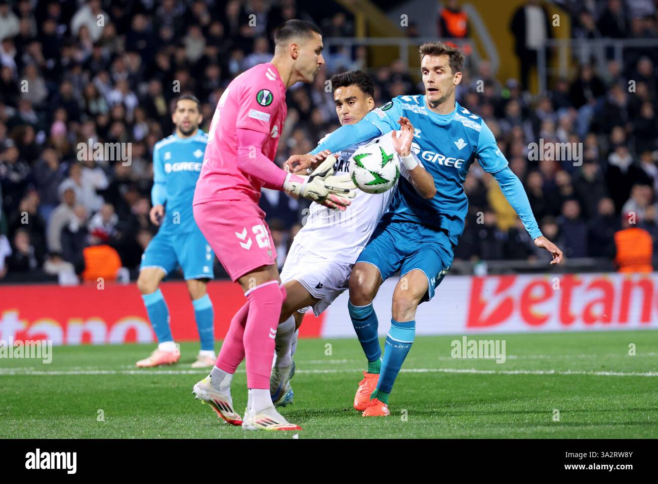 Vitoria's Hevertton Santos, center, vies for the ball with Betis' Diego ...