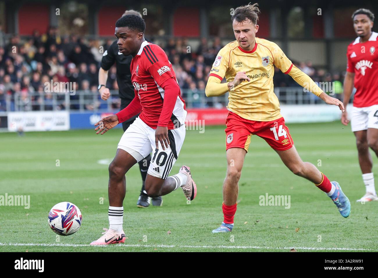 Salford City’s Kelly Nmai and Grimsby Town’s Luca Barrington during the ...