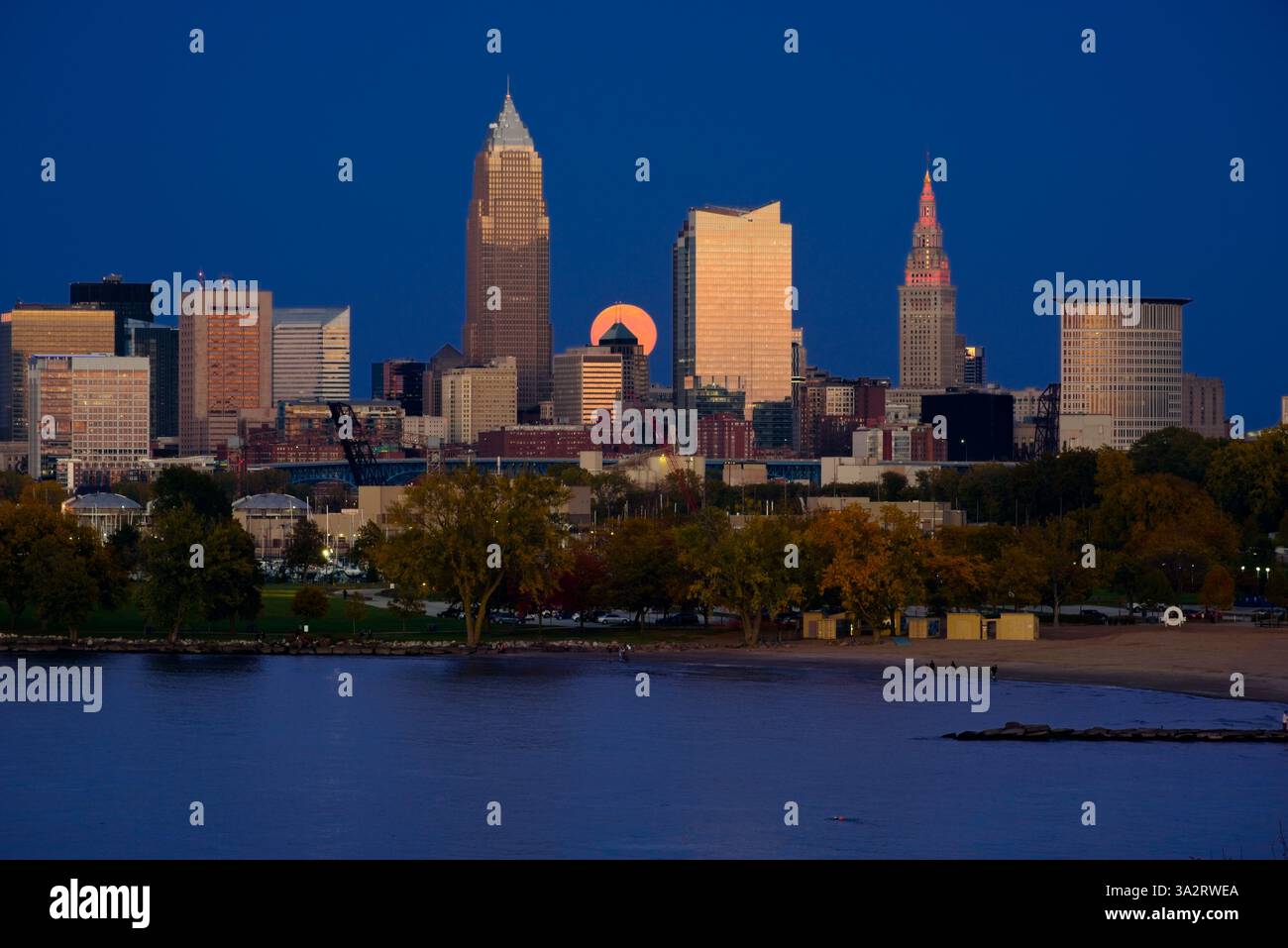 The full moon of October 17, 2024 appearis between two towers on the ...