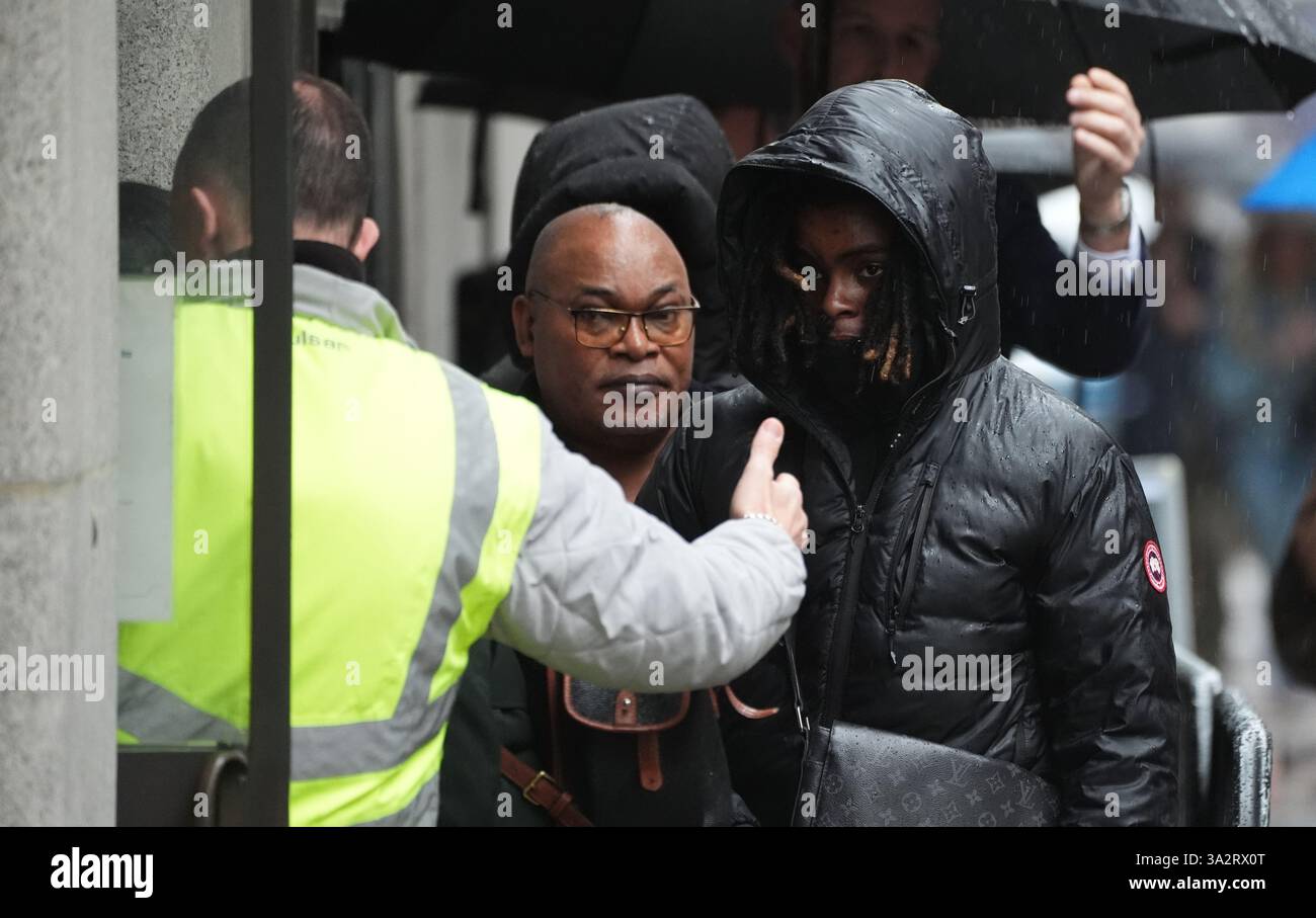 Prosper Kaba (centre), the father of Chris Kaba, arriving at the Old ...