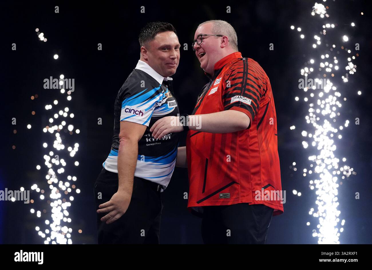 Gerwyn Price and Stephen Bunting embarce during night six of the BetMGM ...