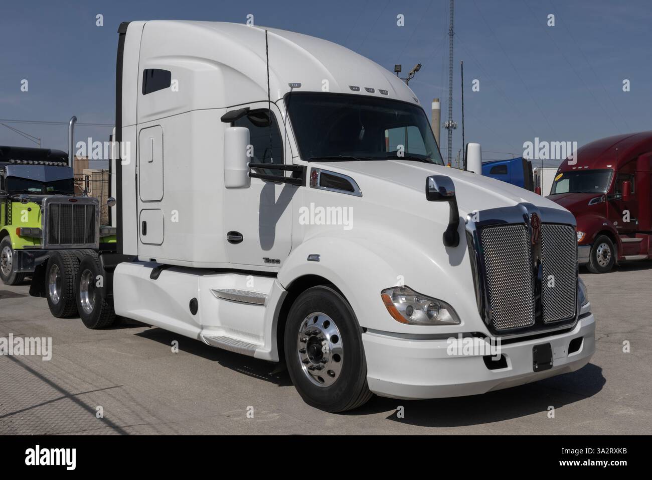 Indianapolis - March 12, 2025: Kenworth Semi Tractor Trailer Big Rig Trucks display at a ...