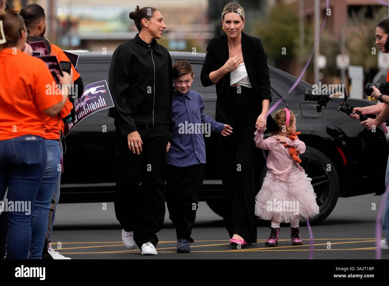 Former Phoenix Mercury player Diana Taurasi, left, arrives for her ...