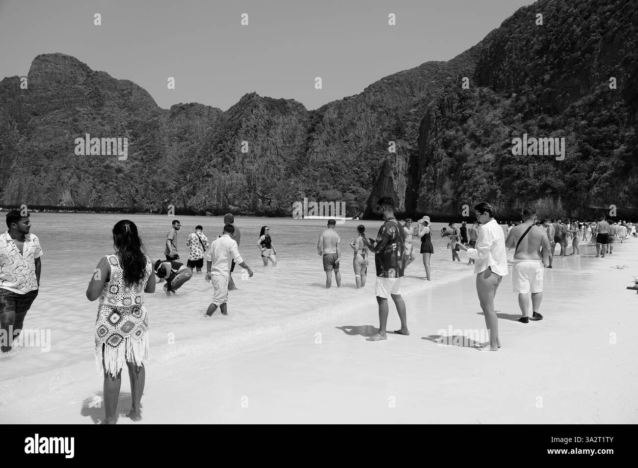 A crowded Maya Bay in Ko Phi Phi Lee, where tourists wade through the ...