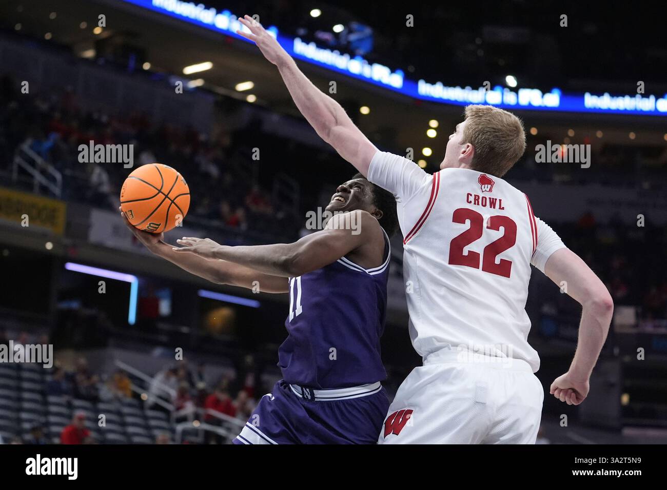 Wisconsin forward Steven Crowl (22) defends Northwestern guard Jordan ...