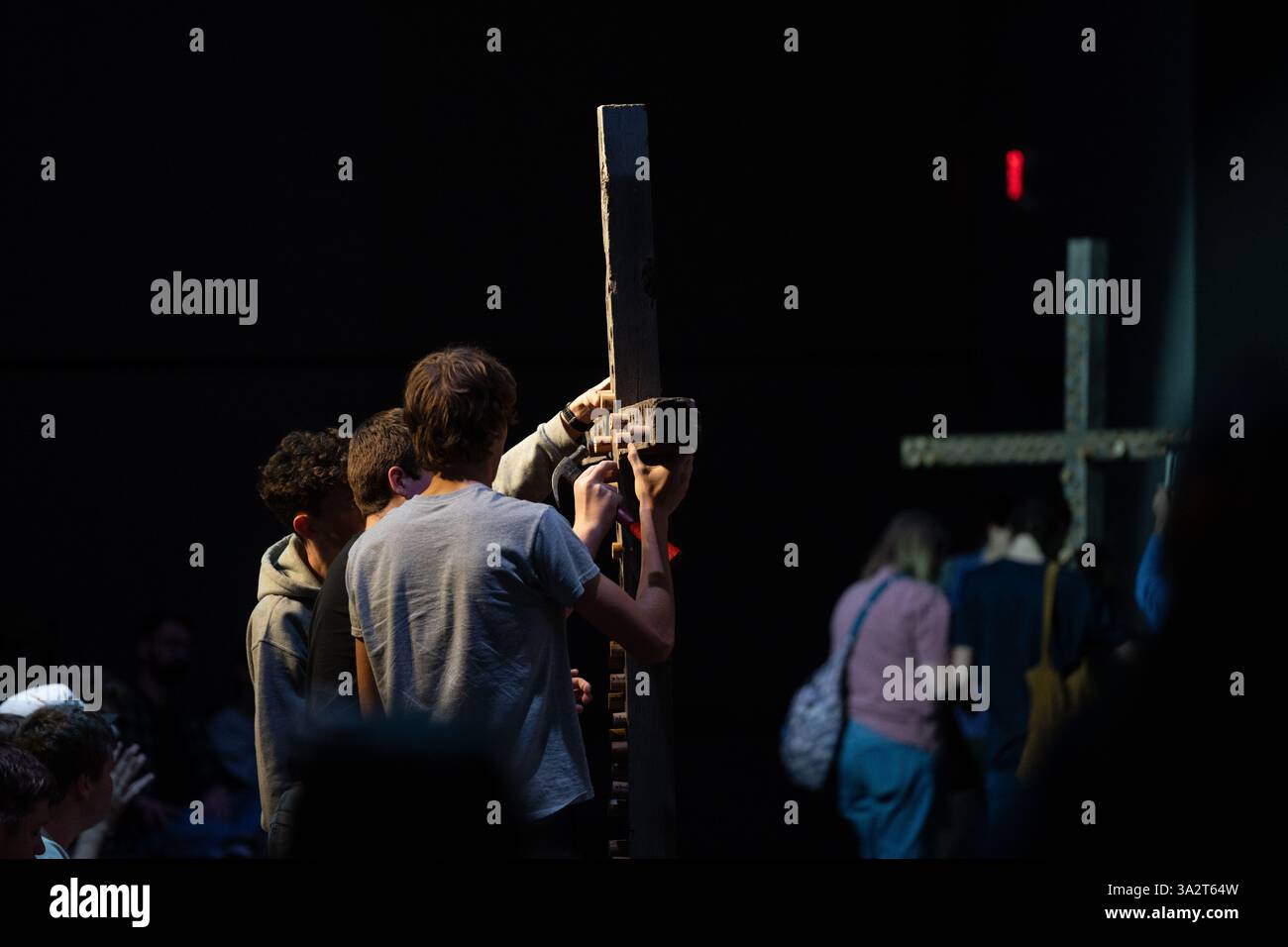 Teen Boys Holding Wooden Cross Stock Photo - Alamy