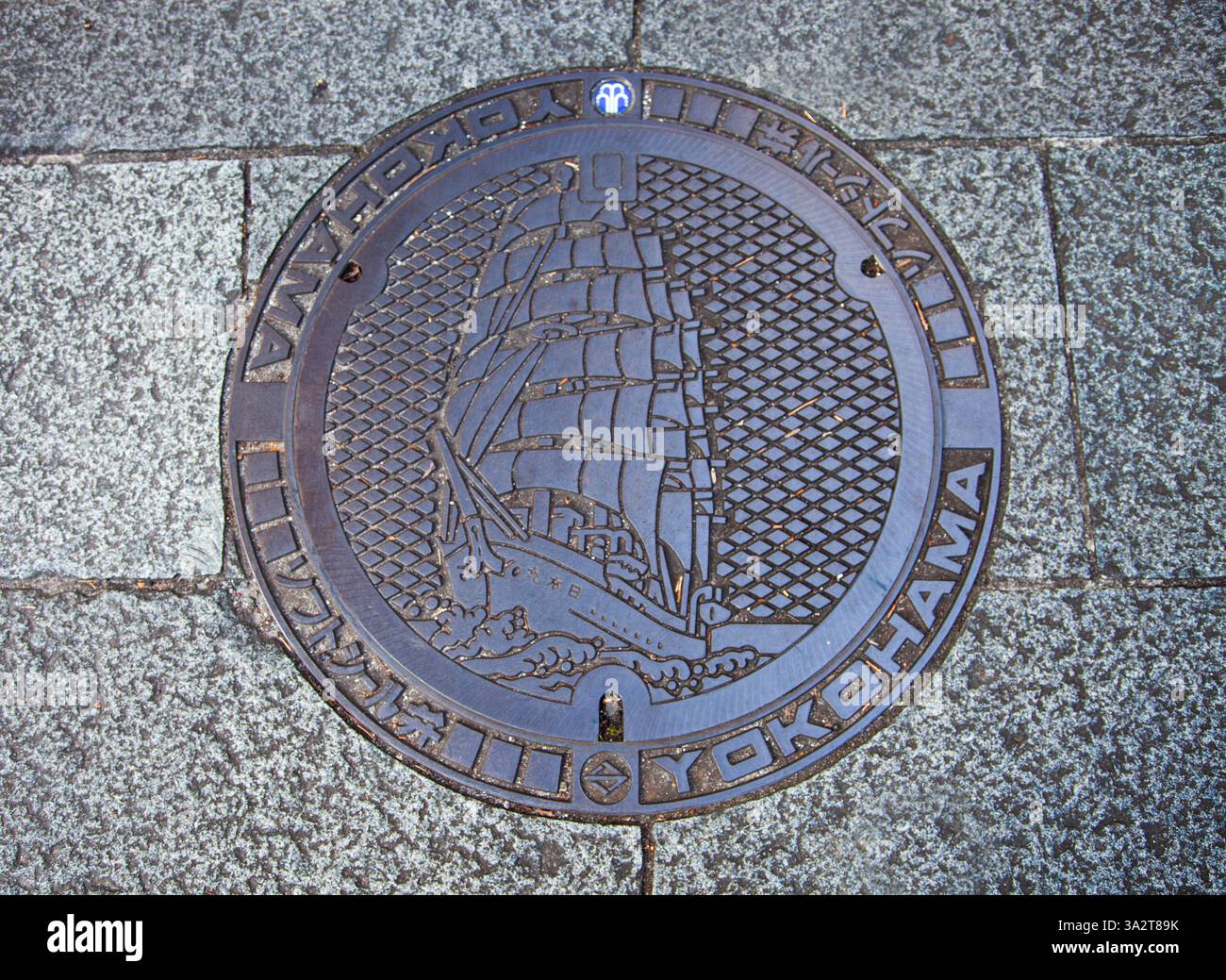 Manhole cover depicting the Nippon Maru sail training ship which is ...