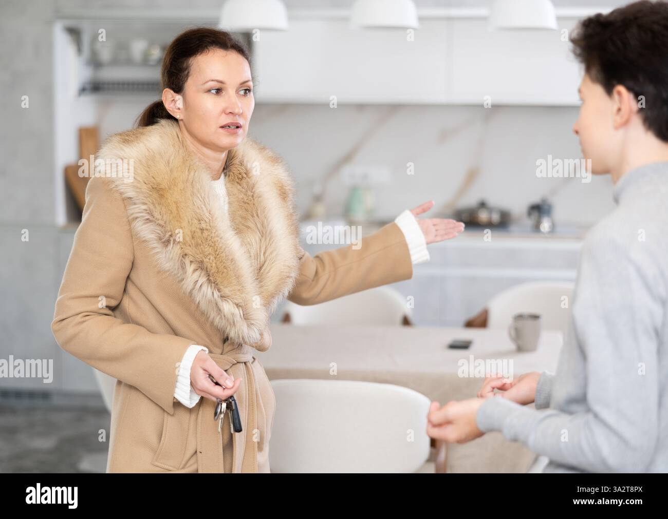 Mother leaving house, son staying home Stock Photo - Alamy