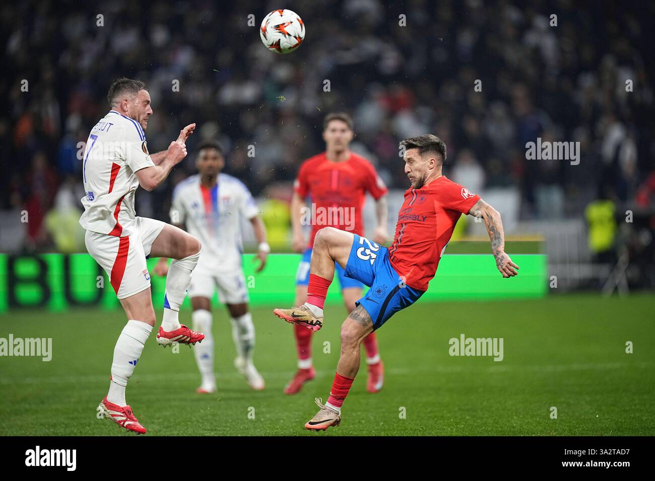 Lyon's Jordan Veretout , left, and FSBC's Alexandru Baluta challenge ...