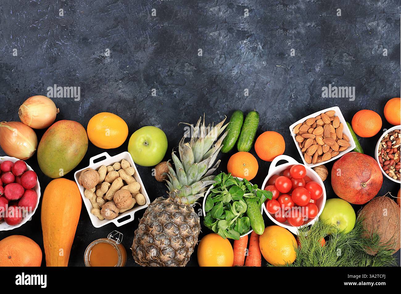 Healthy balanced food with diet ingredients, vegetables, fruits, nuts ...