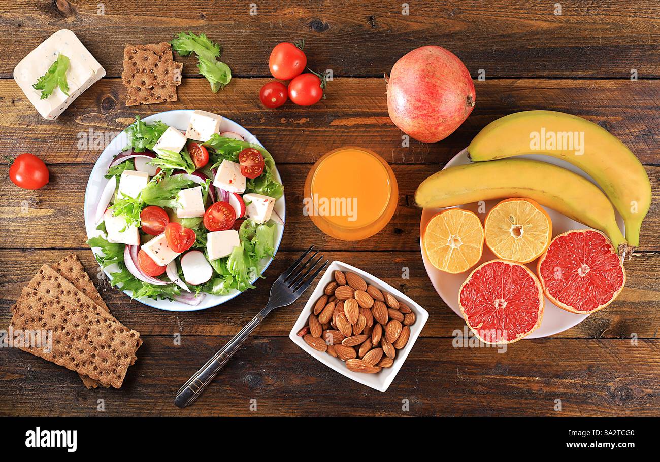 Healthy balanced food with dietary ingredients, vegetable salad with ...