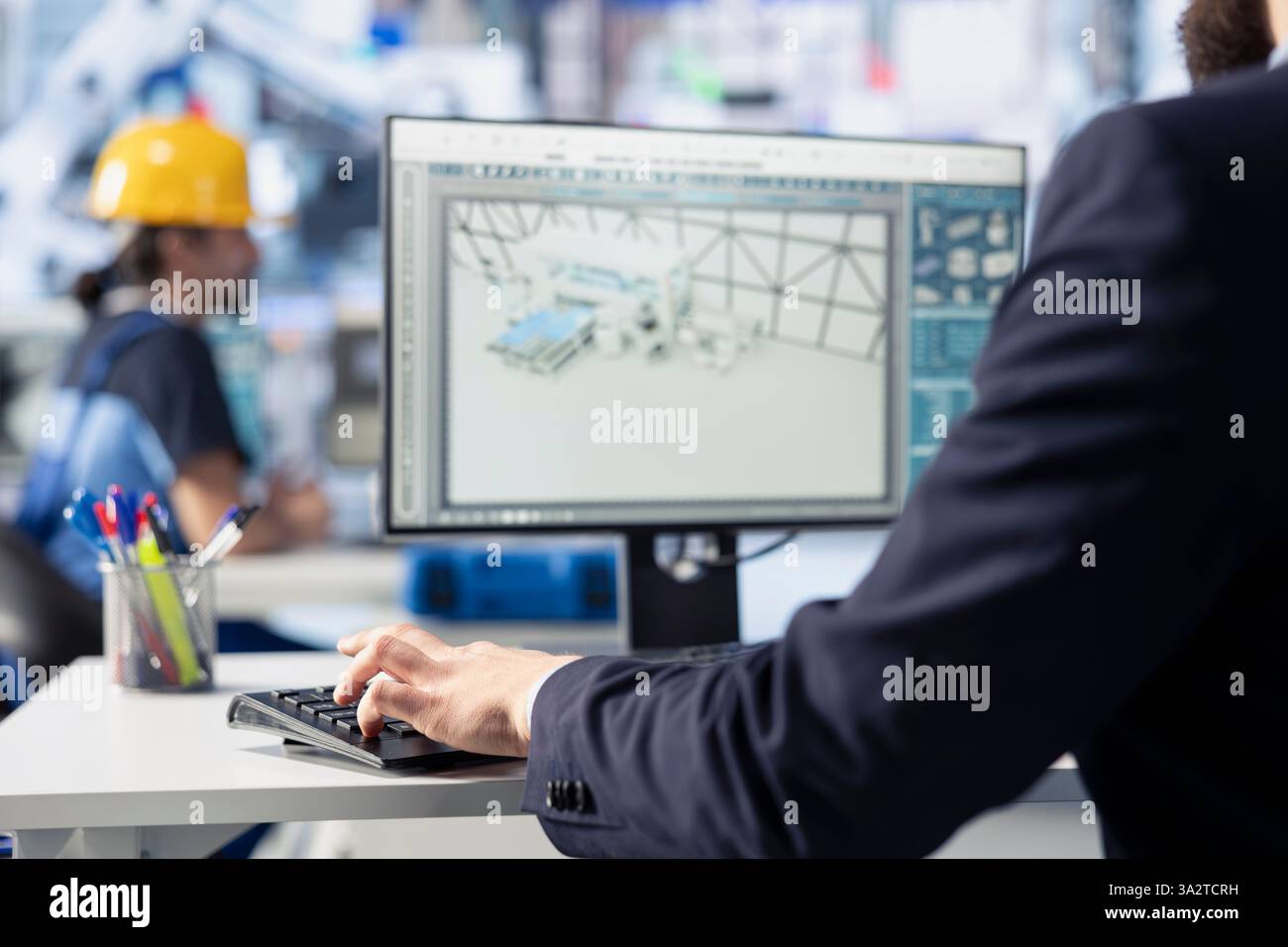 Photovoltaics factory worker programming solar manufacturing machinery using PC, finetuning ...