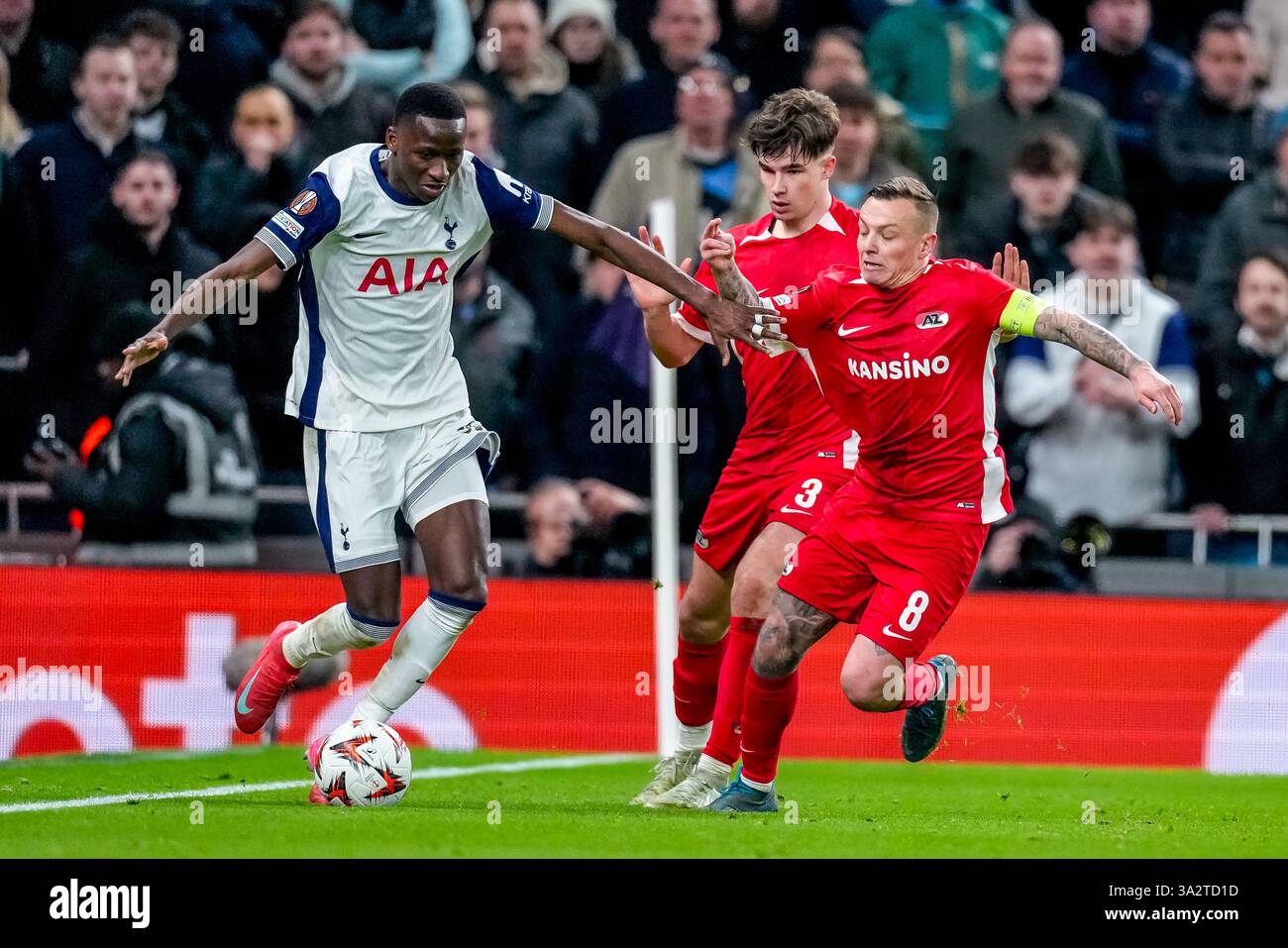 LONDON, ENGLAND - MARCH 13: Pape Sarr of Tottenham battles for the ball ...