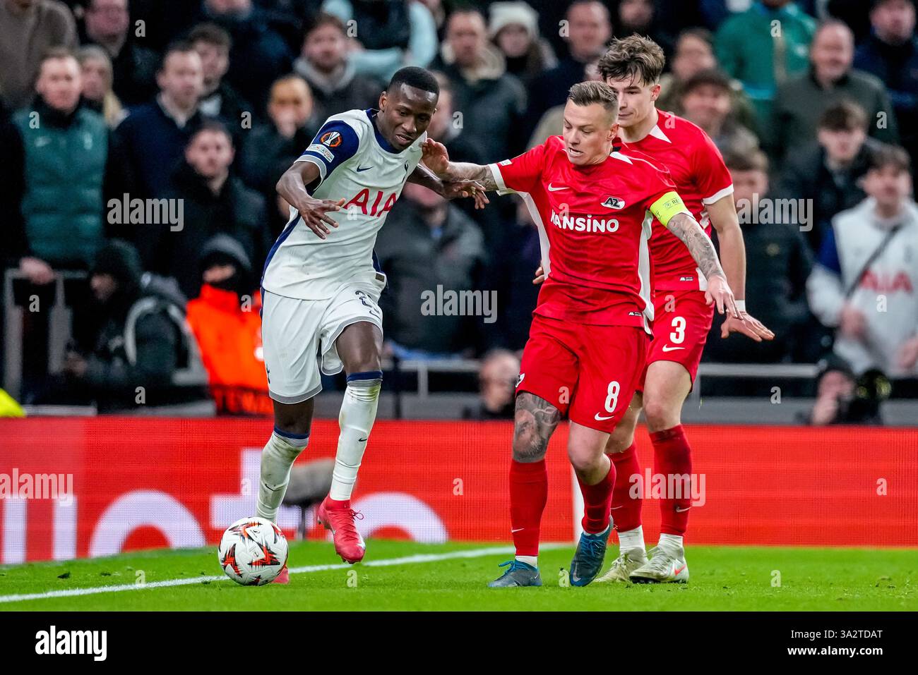 LONDON, ENGLAND - MARCH 13: Pape Sarr of Tottenham battles for the ball ...