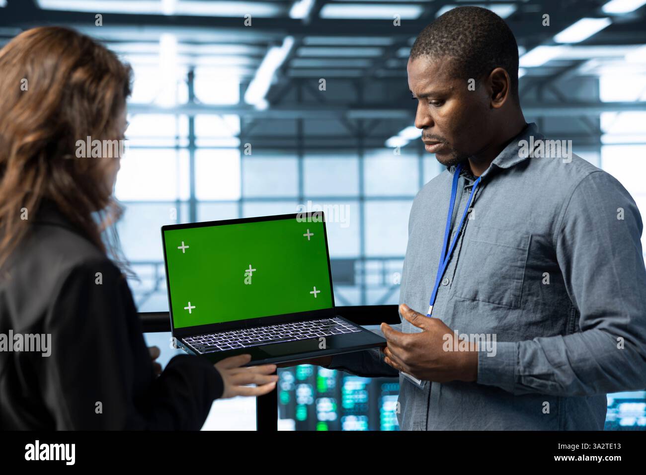 Technicians examining servers in data hi-res stock photography and images - Alamy