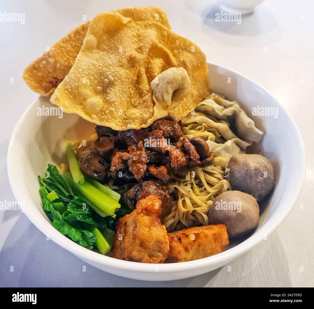 Chicken noodle meatball or mie ayam bakso, a popular street food in ...