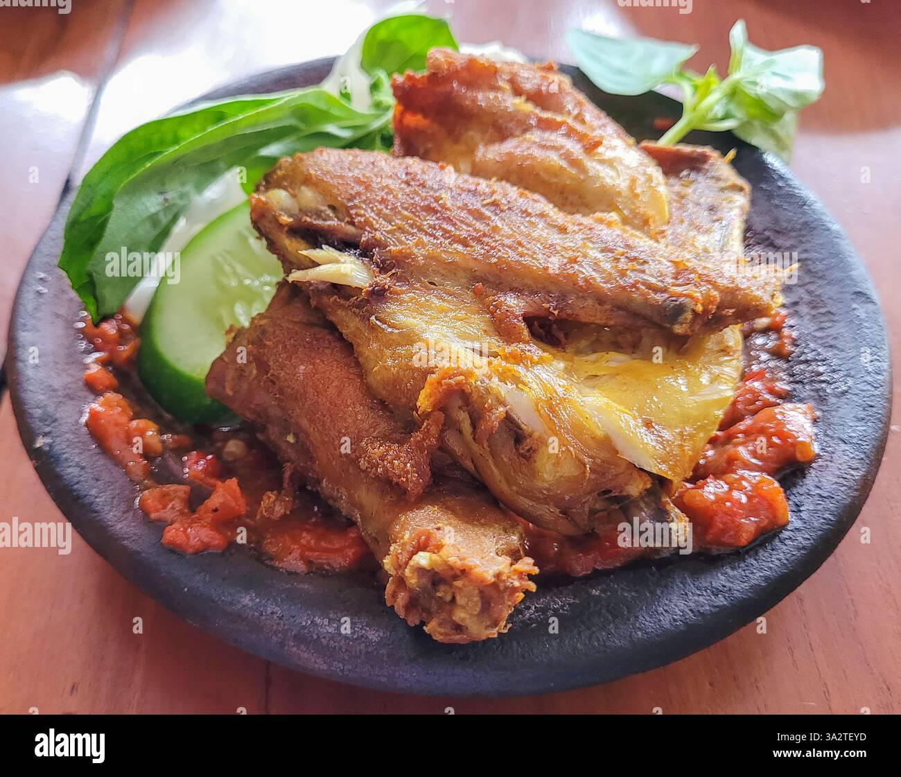 Indonesian food ayam penyet or squeezed fried chicken from East Java in ...