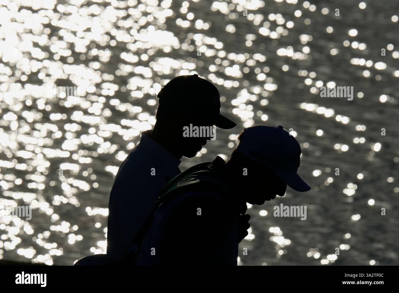 Xander Schauffele, left, and his caddie Austin Kaiser walk up the the ...