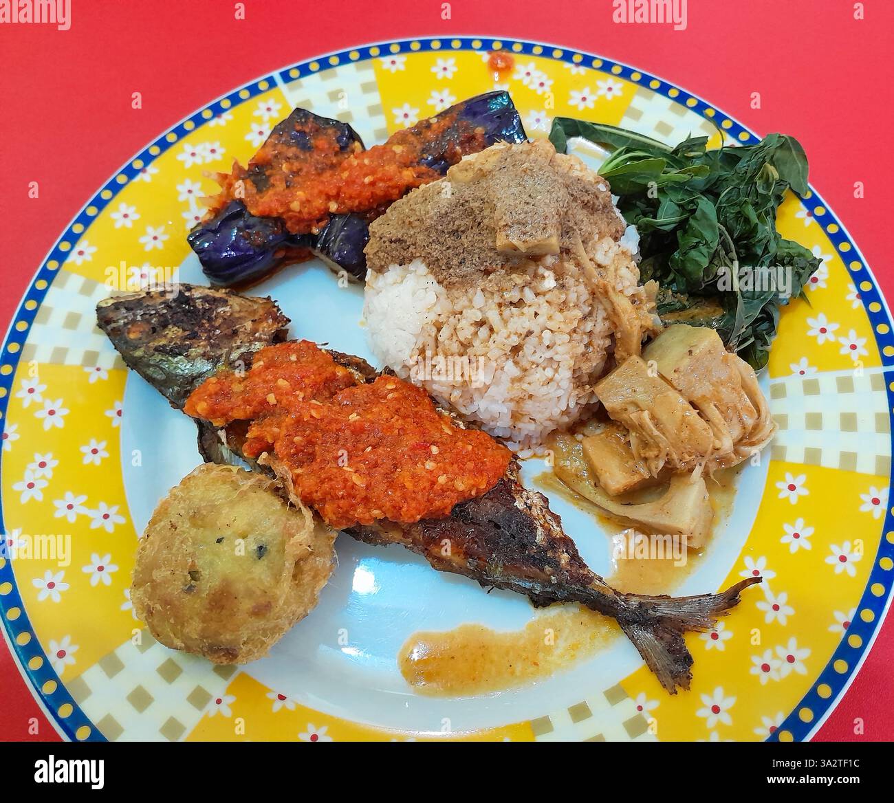 Nasi Padang Indonesian food from West Sumatra with fried fish, potato ...