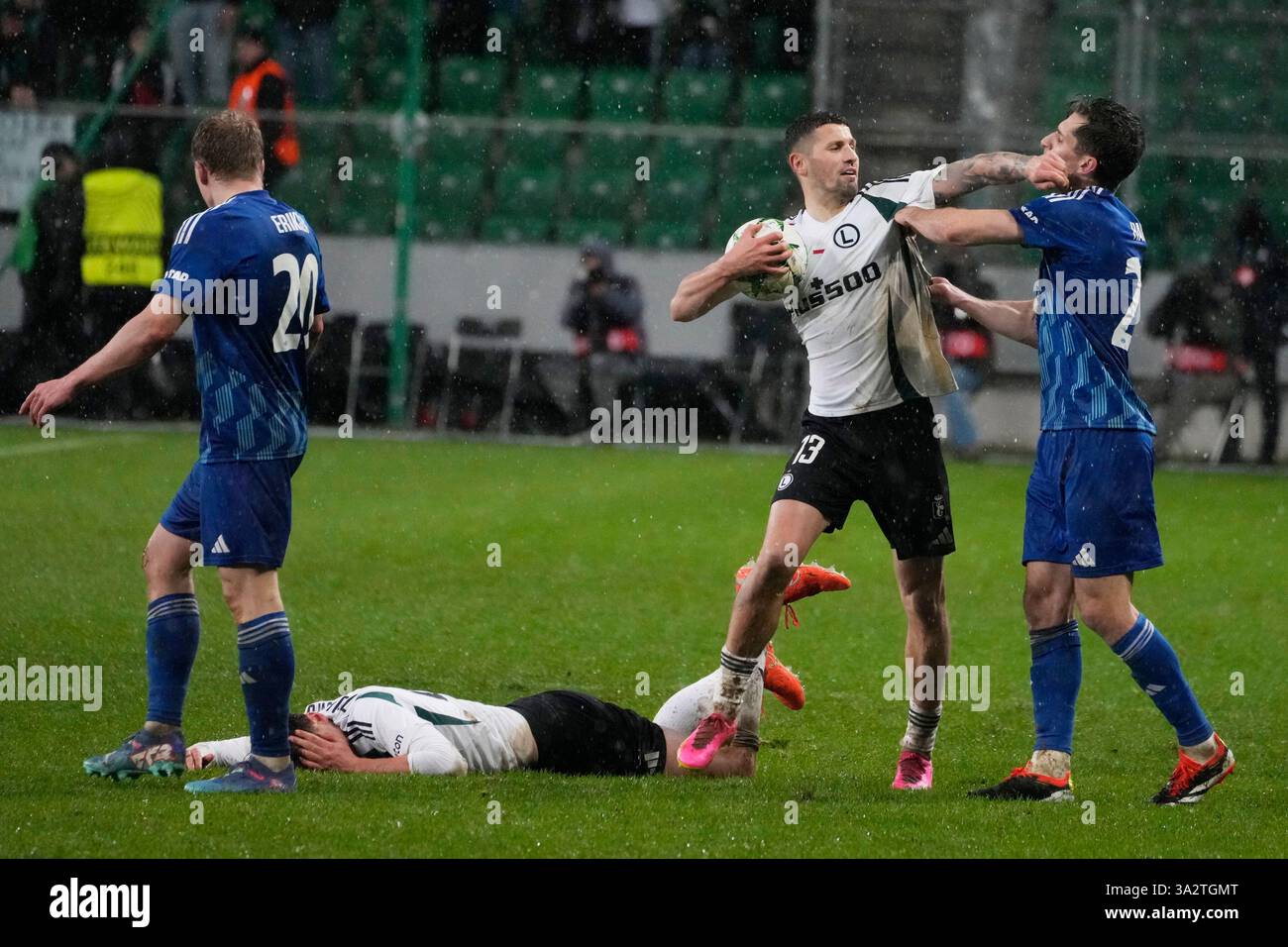 Legia's Pawel Wszolek, second from right, and Molde's Kristoffer Haugen ...