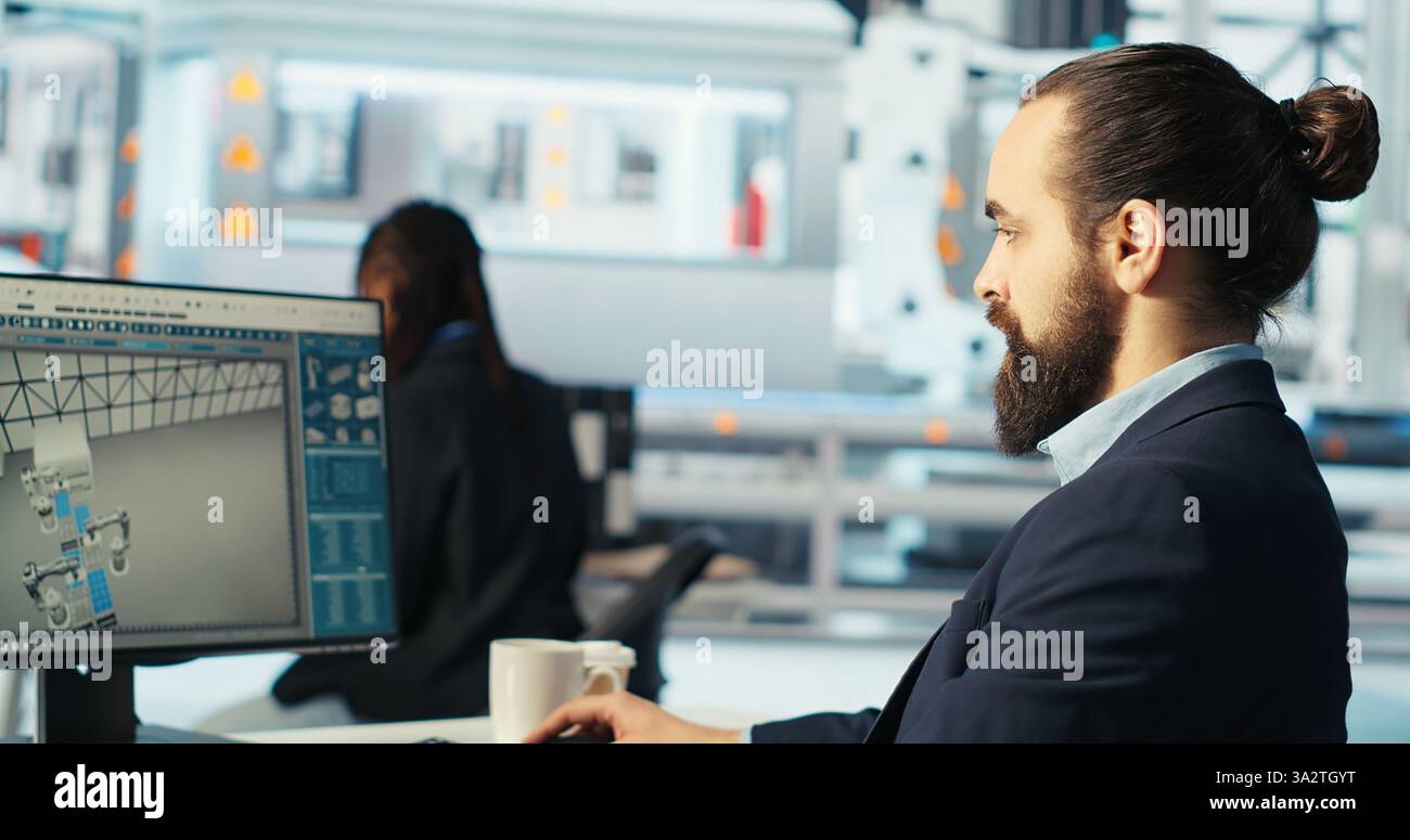 Engineer in photovoltaics factory using PC screen to diagnose ...