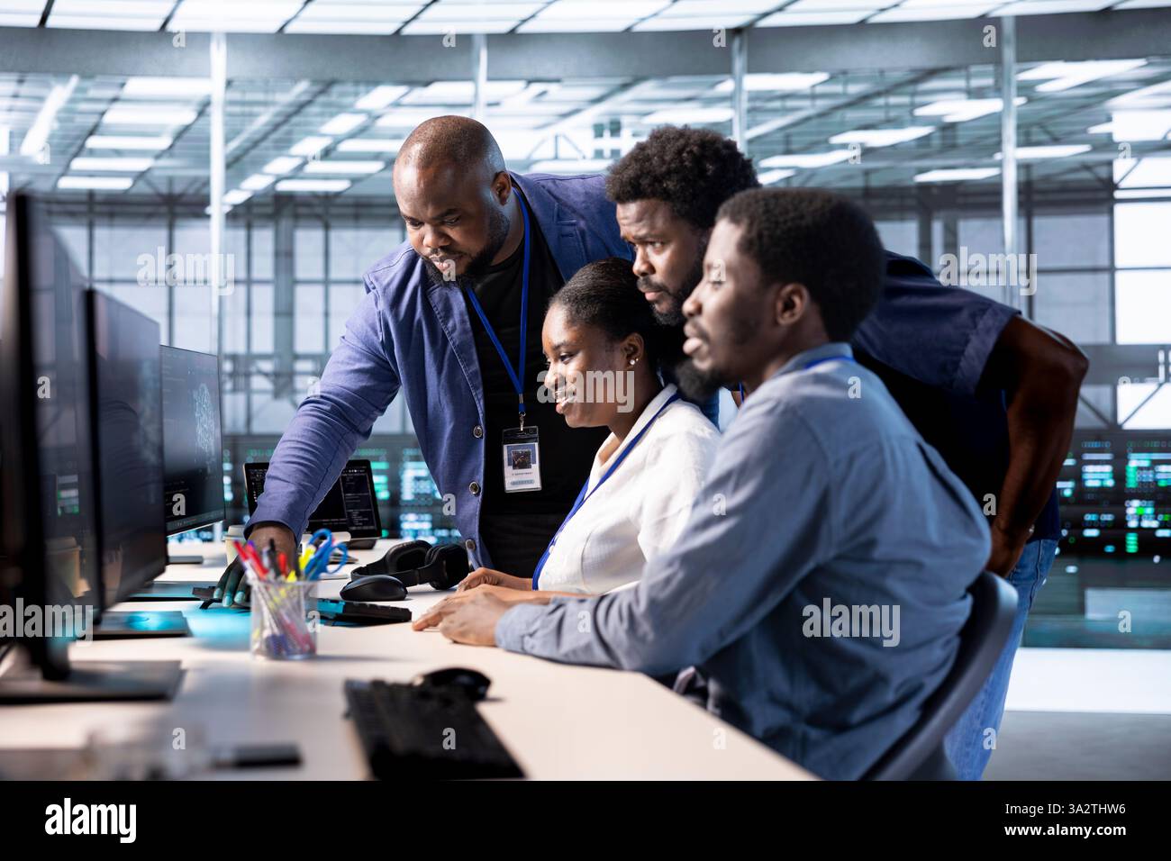 Group of technicians doing brainstorming, reconfiguring server farm to optimize it for data ...