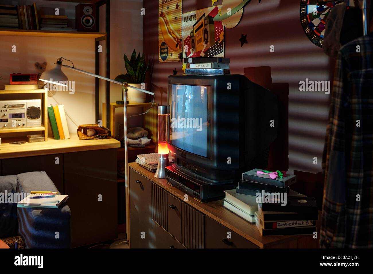 Vintage living room setup with retro TV set, bookshelf filled with ...