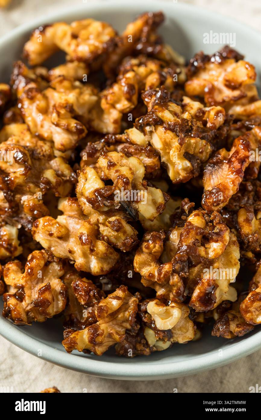 Sweet Homemade Candied Walnut Pieces in a Bowl with Cinnamon Sugar ...