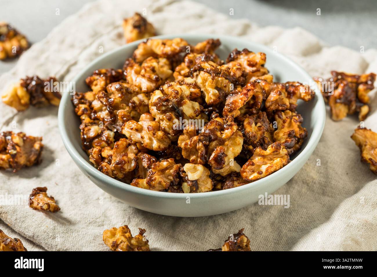 Sweet Homemade Candied Walnut Pieces in a Bowl with Cinnamon Sugar ...