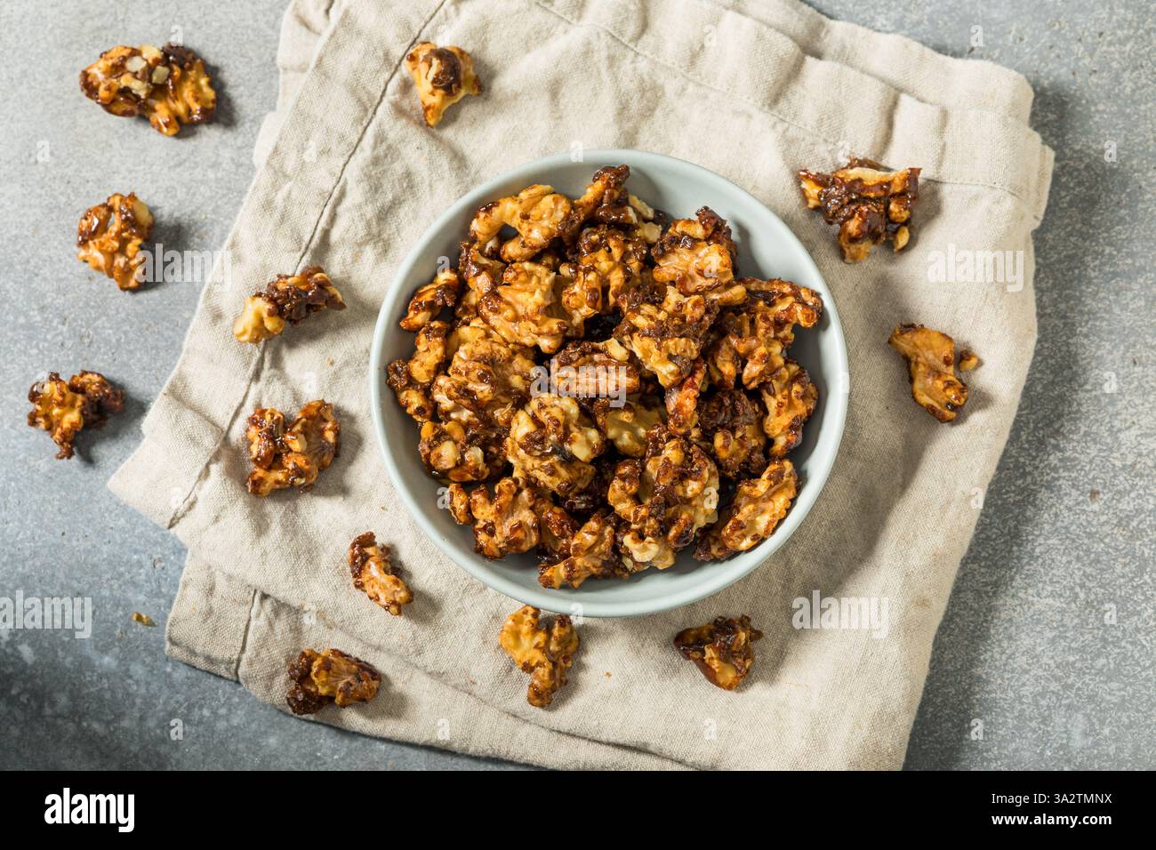 Sweet Homemade Candied Walnut Pieces in a Bowl with Cinnamon Sugar ...