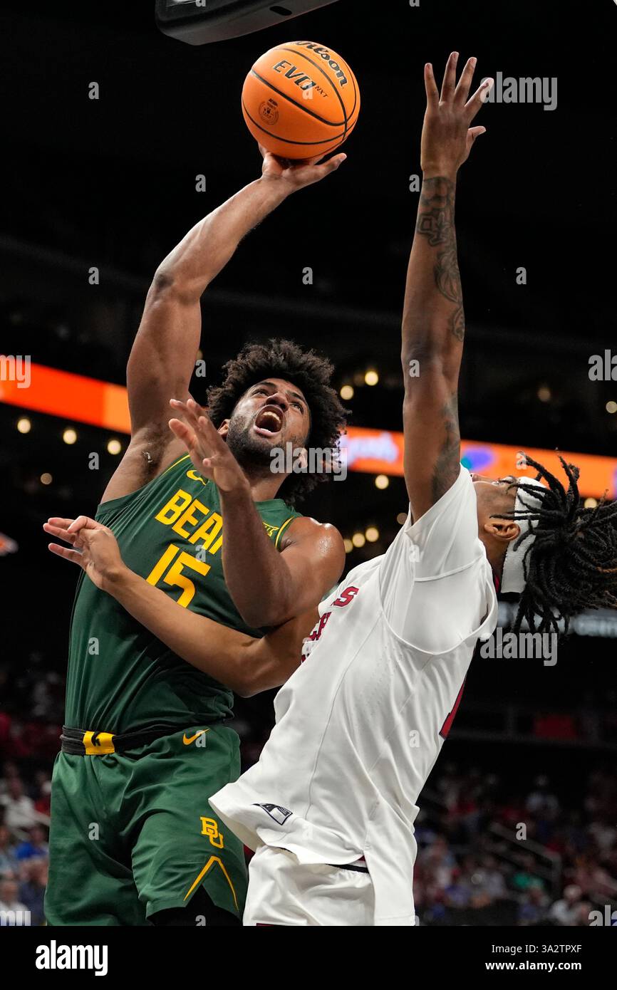 Baylor's Norchad Omier, left, shoots over Texas Tech's JT Toppin during ...