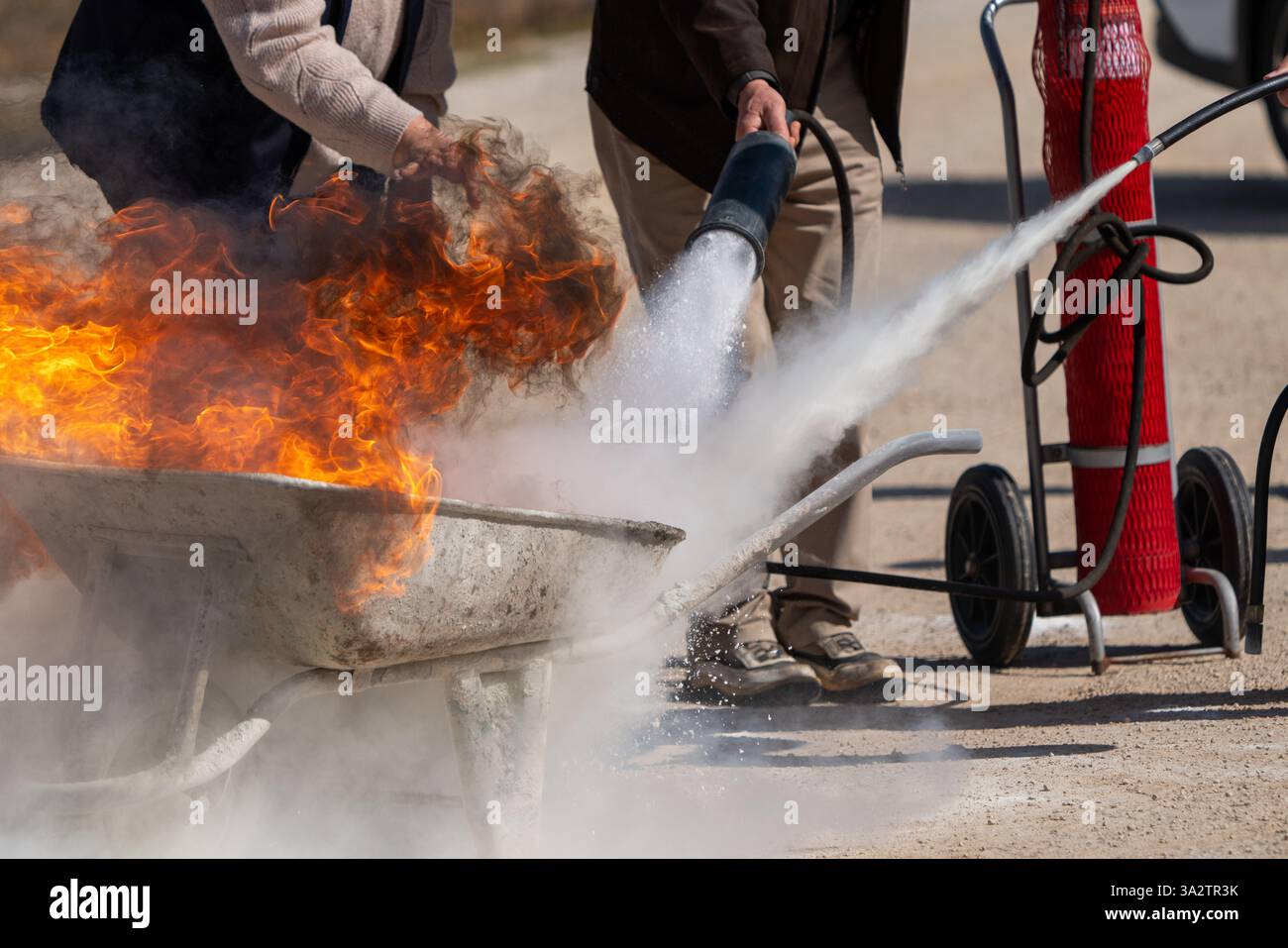 Fire extinguisher used during fire drill in Turkey Stock Photo - Alamy