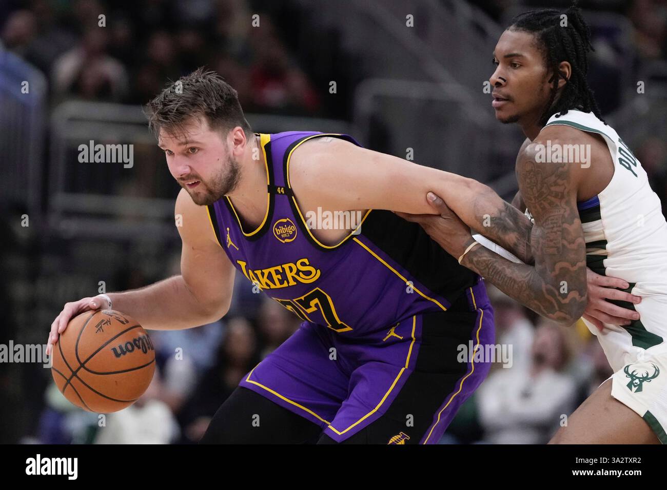 Los Angeles Lakers' Luka Doncic tries to get by Milwaukee Bucks' Kevin ...