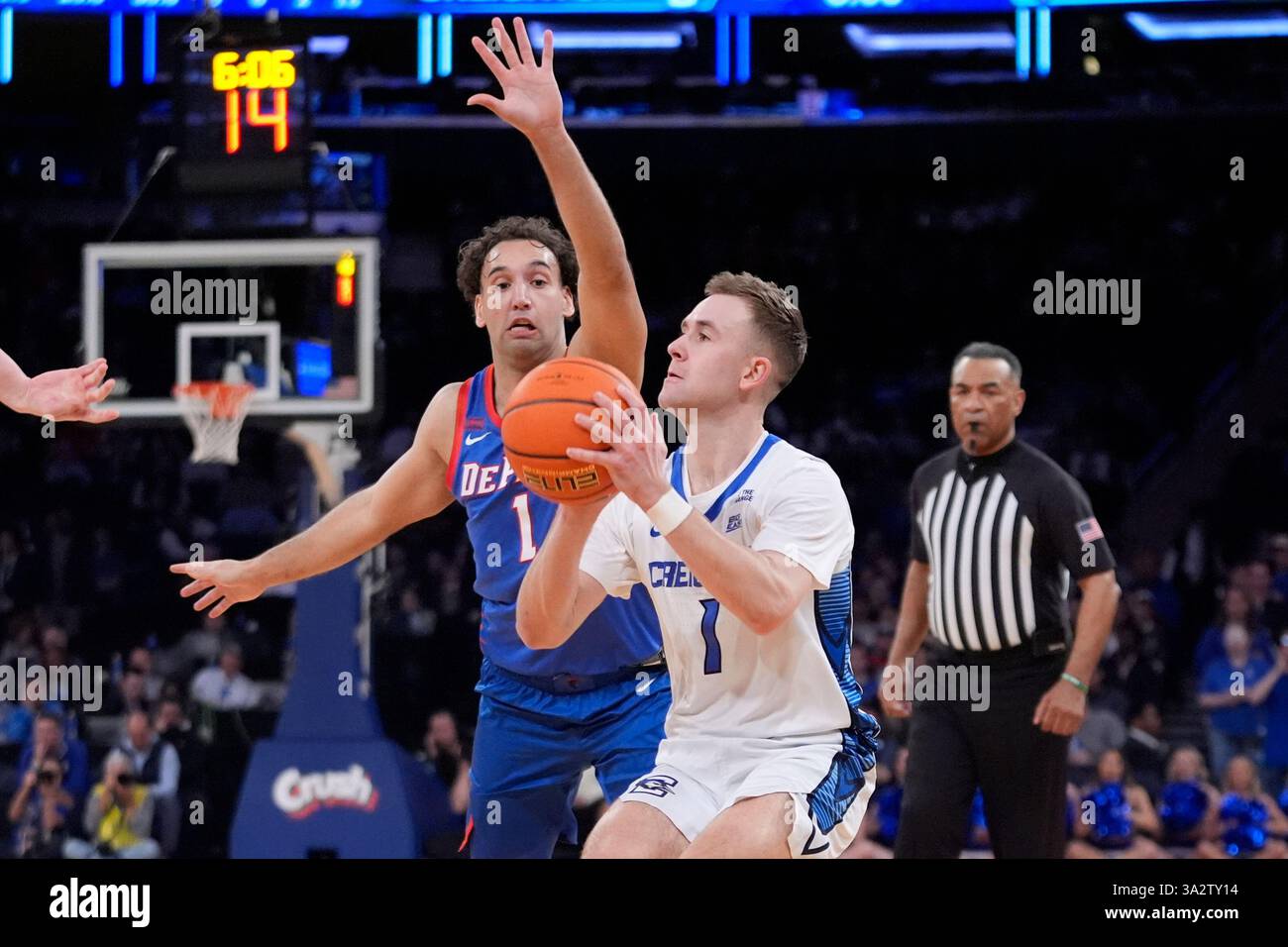 DePaul's Isaiah Rivera (1) defends a shot by Creighton's Steven ...