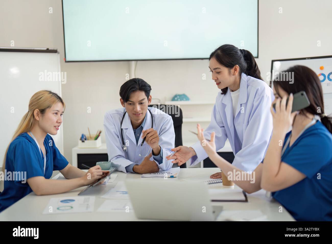 Collaborative healthcare meeting. Medical professionals discussing ...