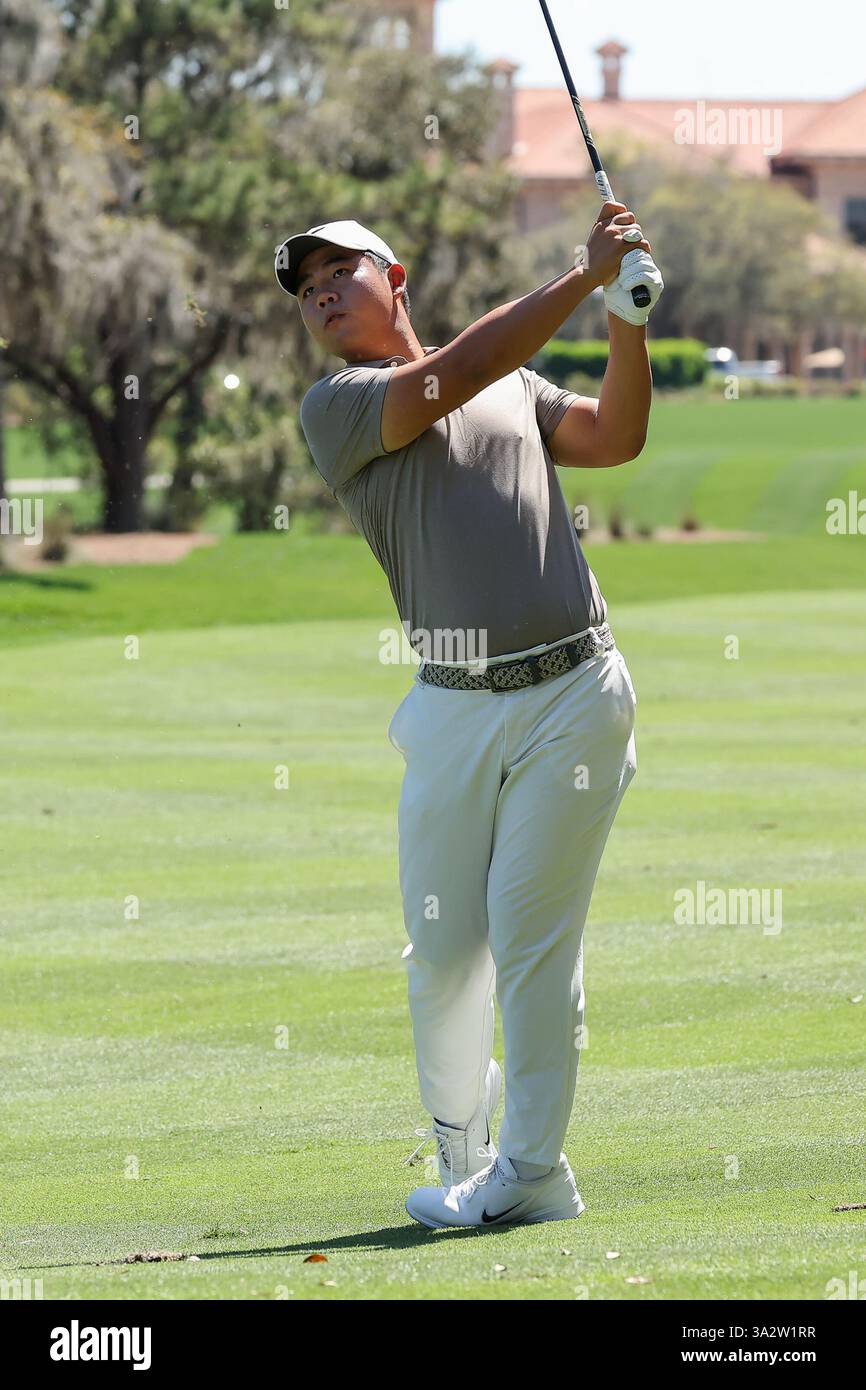 Ponte Vedra, FL, USA. 13th Mar, 2025. Tom Kim hits an approach shot on ...