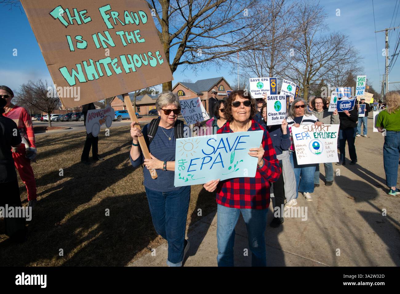 Ann Arbor, Michigan, USA. 13th Mar, 2025. People march at a save-the ...