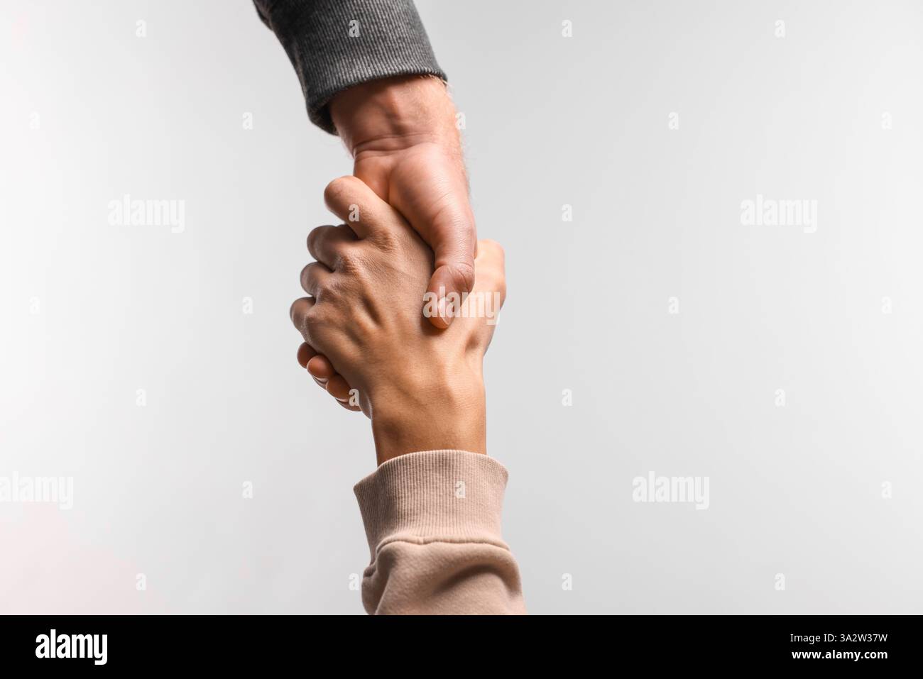 Help and support. People holding hands on light grey background ...