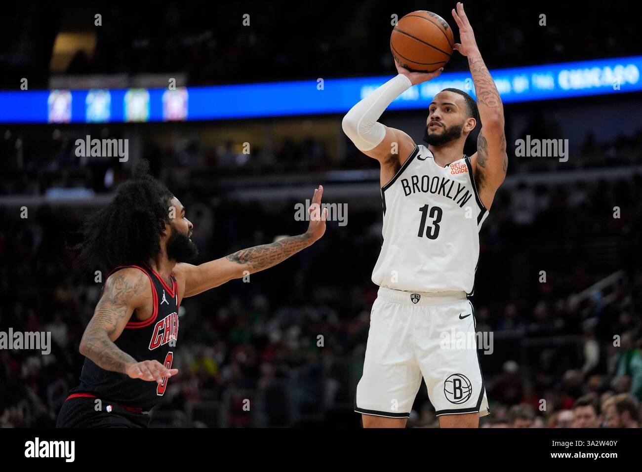 Brooklyn Nets guard Tyrese Martin (13), right, sinks a shot over ...