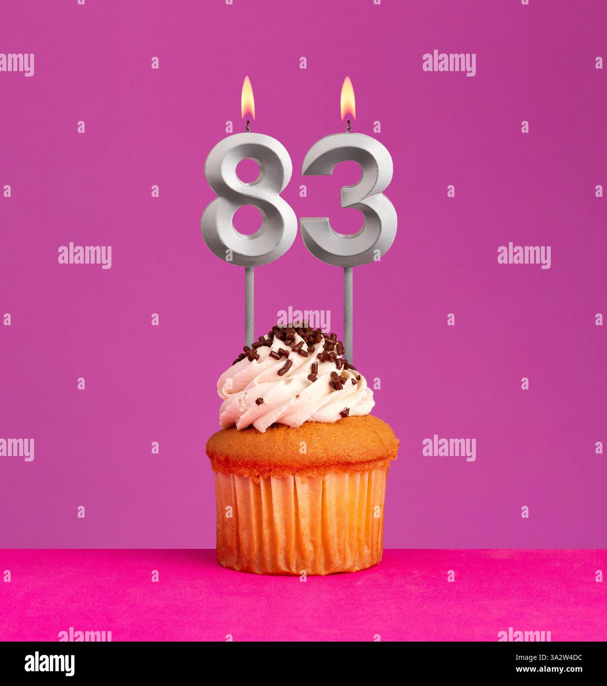 Birthday candle number 83 with cupcake on violet background Stock Photo ...