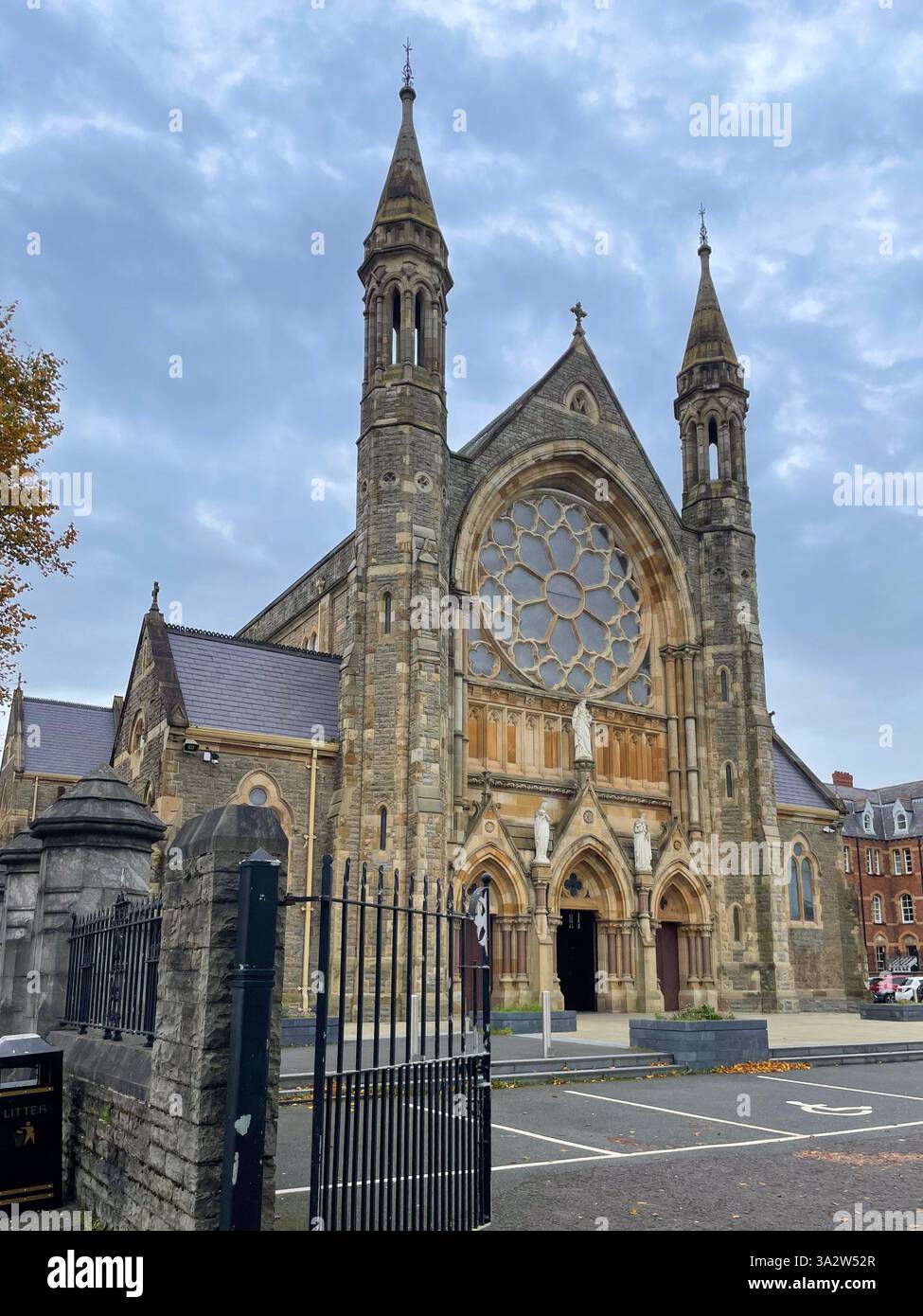 Stunning Gothic Revival church with twin spires and a large rose window ...