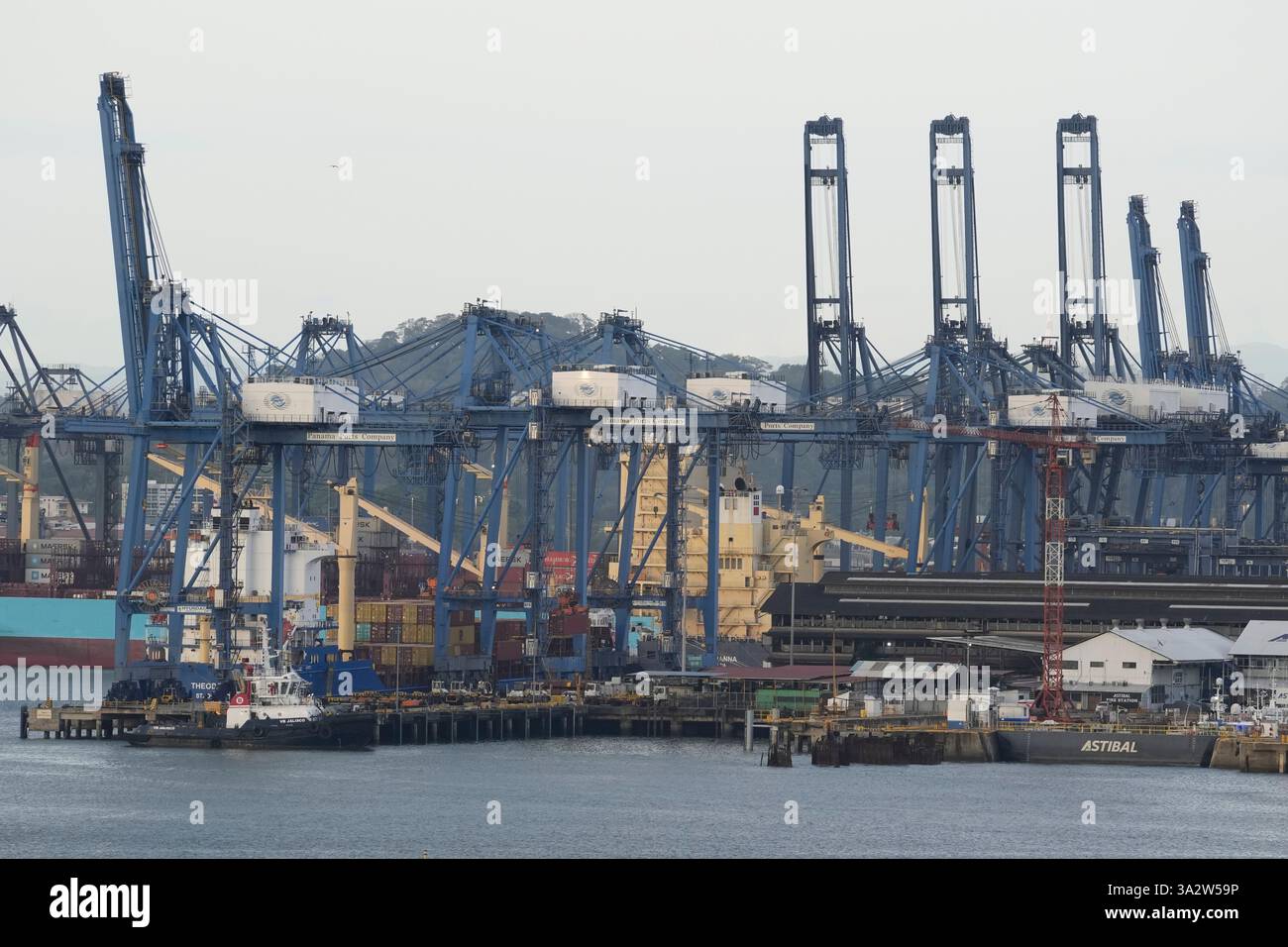 Cranes load a cargo ship at the Panama Canal's Port of Balboa, managed ...
