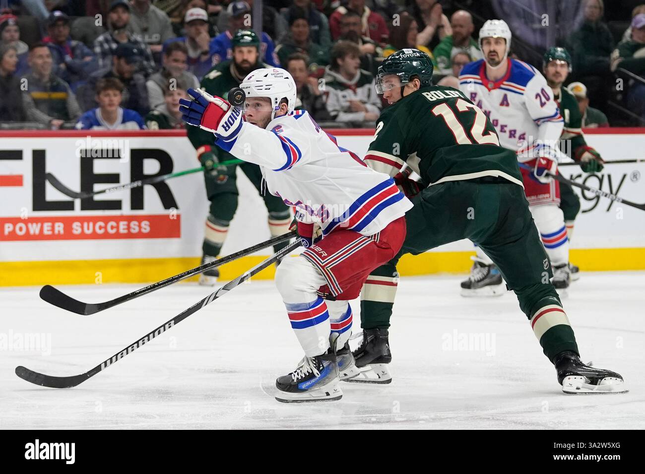 New York Rangers defenseman Zac Jones (6) reaches for the puck during ...