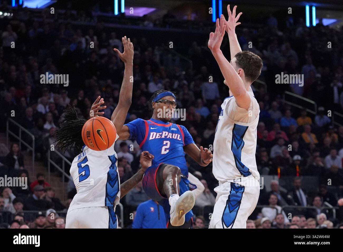 Creighton's Ryan Kalkbrenner, right, and Jamiya Neal, left, defend ...
