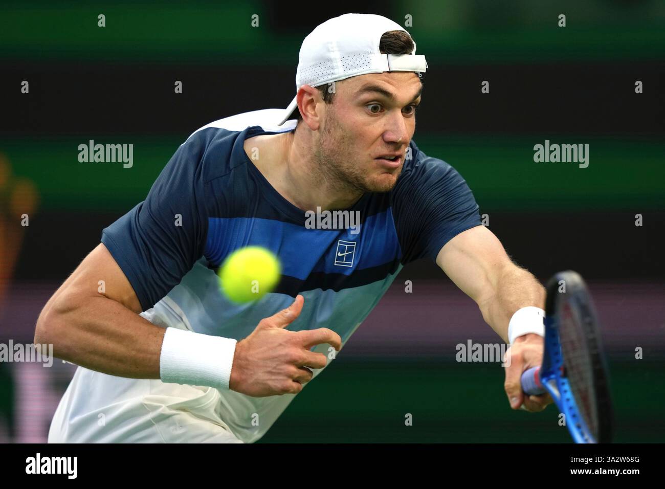 Jack Draper of Britain returns a shot to Ben Shelton during the quarterfinals at the BNP Paribas ...
